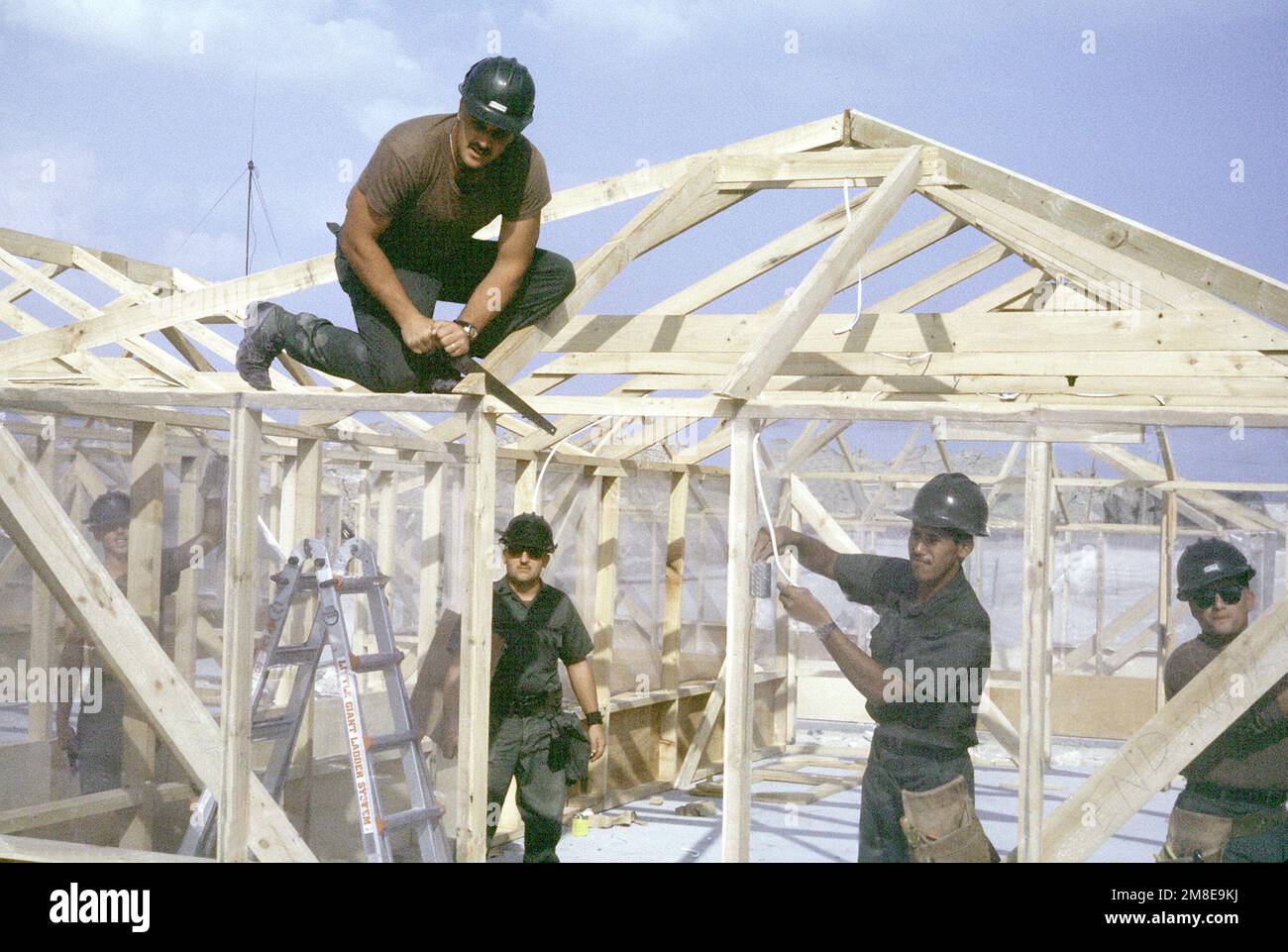 Seabees of Naval Mobile Construction Battalion 74 install electrical ...