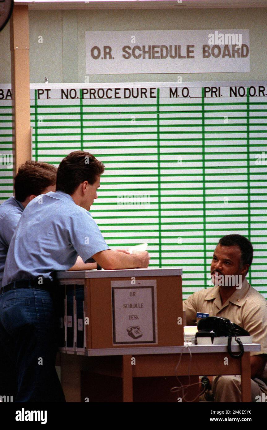 Crew members receive information regarding operating room schedules ...