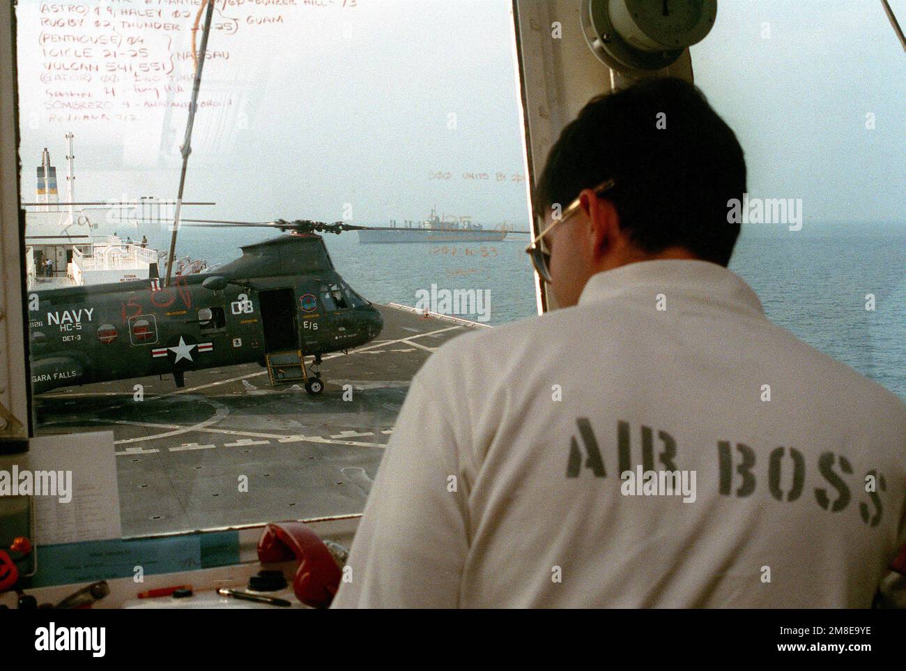 An air boss watches as a Helicopter Combat Support Squadron 5 (HC-5) HH ...