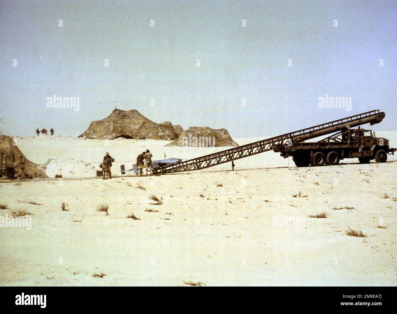 Marines position a Pioneer remotely piloted vehicle (RPV) on a ...