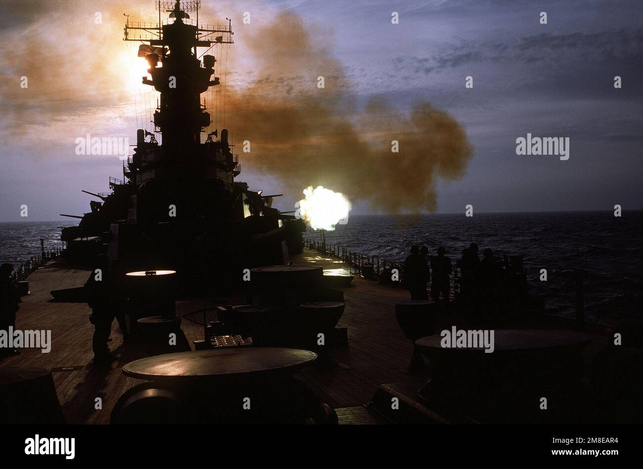 One of the Mark 38 5-inch/38-caliber guns aboard the battleship USS ...