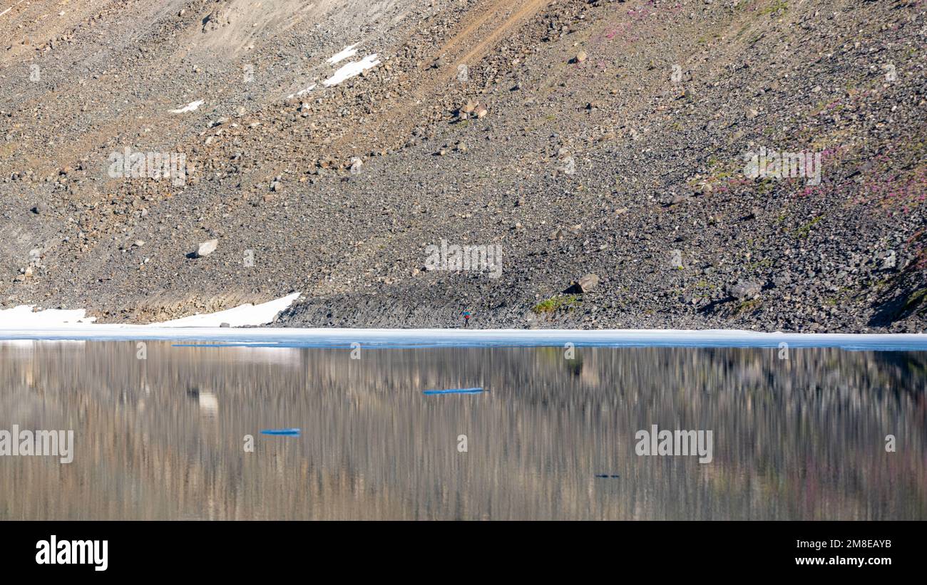A person hiking in an incredible back country area of Yukon Territory ...