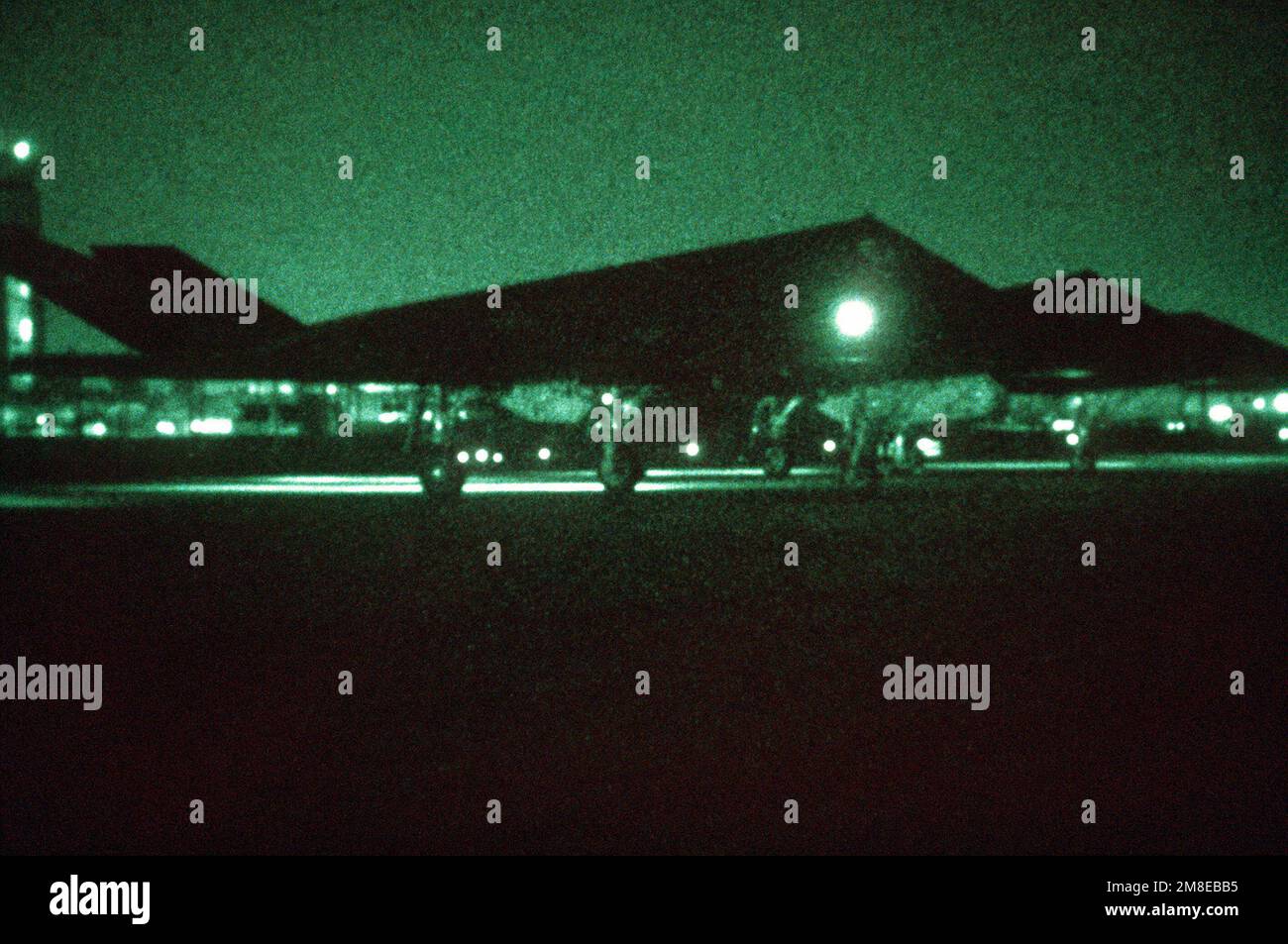 As seen through a night vision lens, three F-117A aircraft from the ...