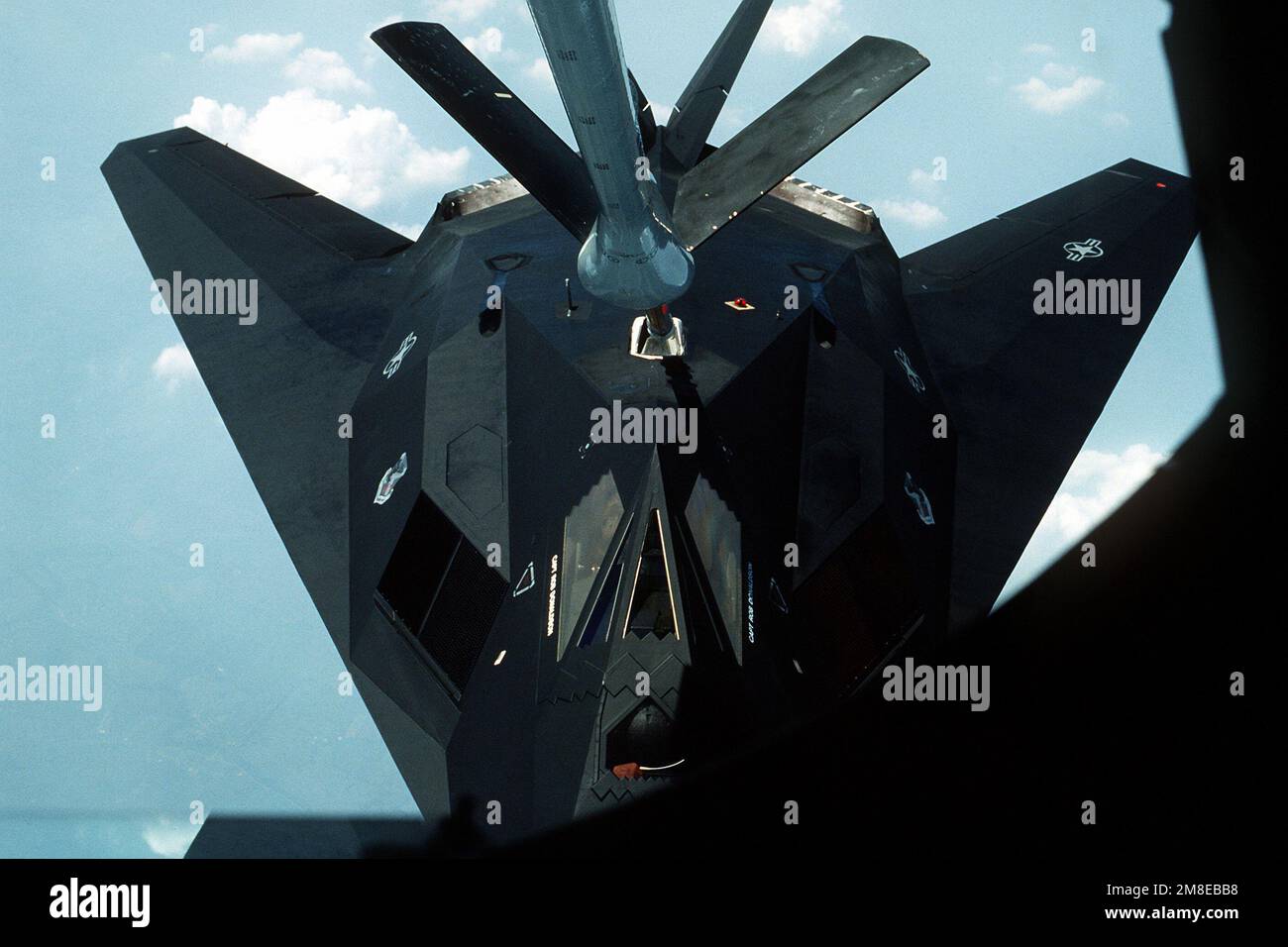 A 37th Tactical Fighter Wing (37th TFW) F-117A aircraft is refueled in ...