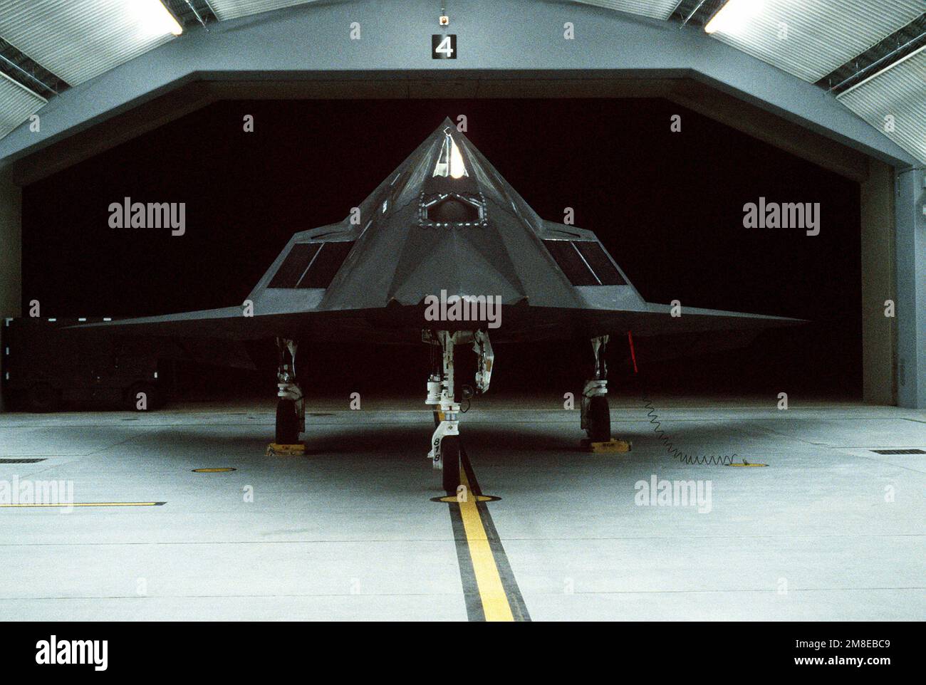A 37th Tactical Fighter Wing (37th TFW) F-117A aircraft sits inside a ...