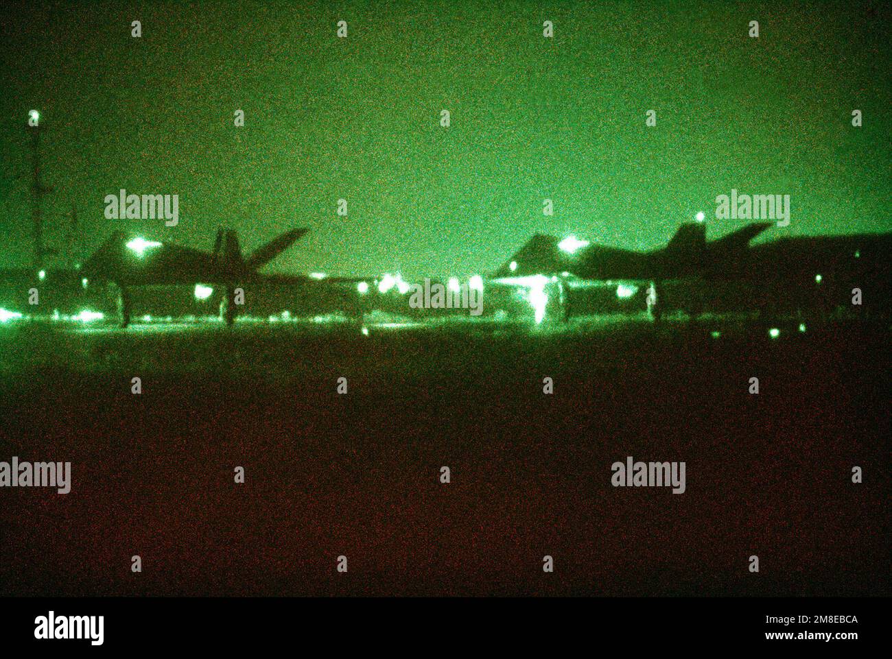 As seen through a night vision lens, two F-117A aircraft from the 37th ...