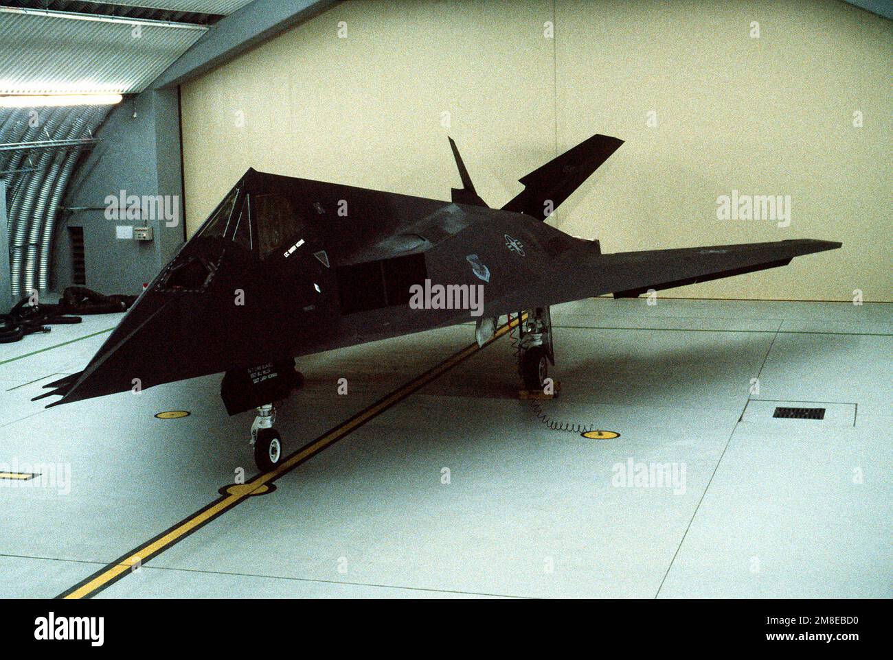 An F-117A aircraft from the 37th Tactical Fighter Wing (37th TFW) sits ...