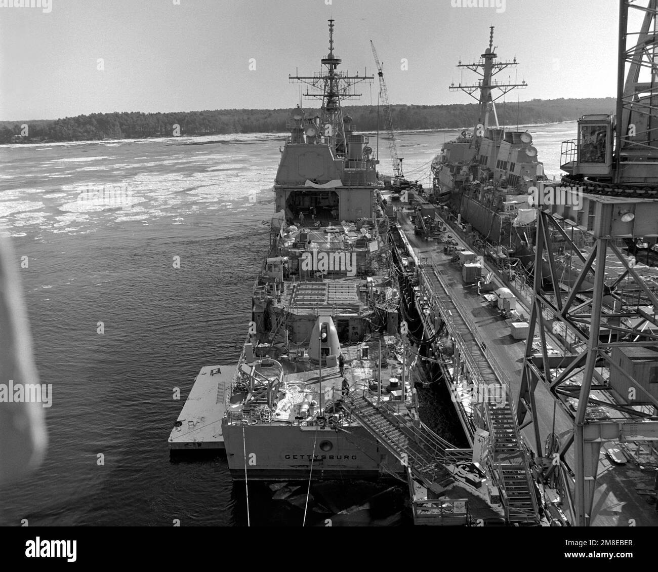 A stern view of the guided missile cruiser Gettysburg (CG-64) moored to ...