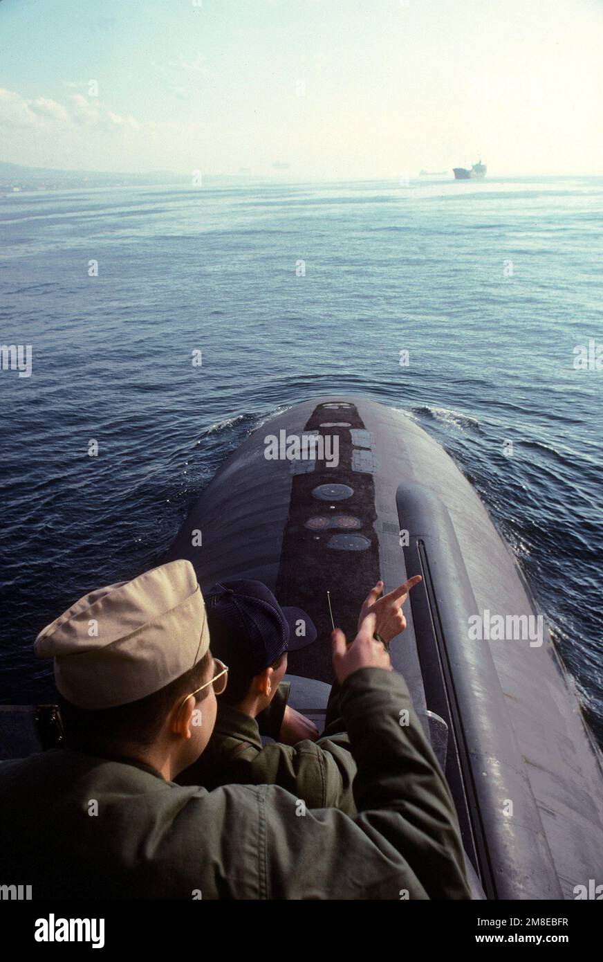 The officer of the deck aboard the nuclear-powered attack submarine USS ...
