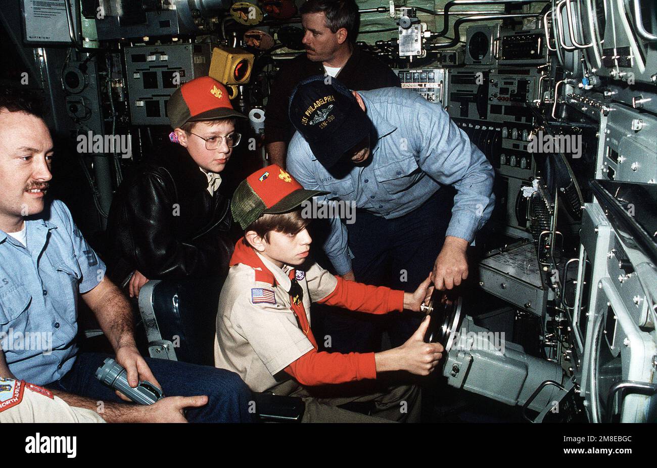 Emiliano Henry, a member of Boy Scout Troop 85, mans the dive planes of ...
