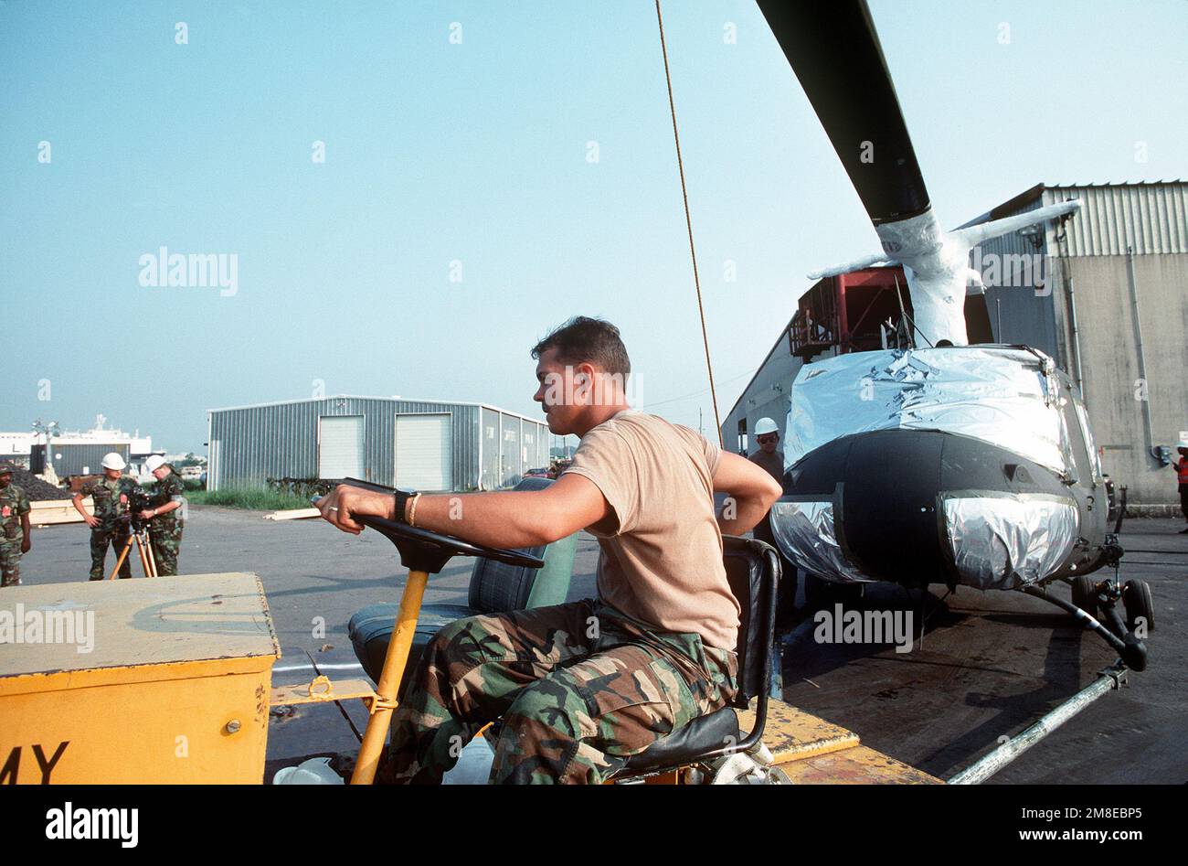 A member of the 1181st Transportation Terminal Unit tows a 101st Combat ...