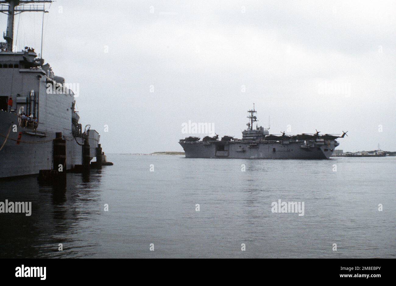 The amphibious assault ship USS IWO JIMA (LPH-2) heads out to sea after ...