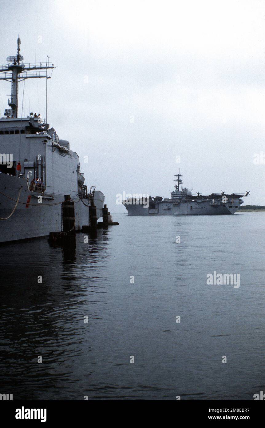 The amphibious assault ship USS IWO JIMA (LPH-2) heads out to sea after ...