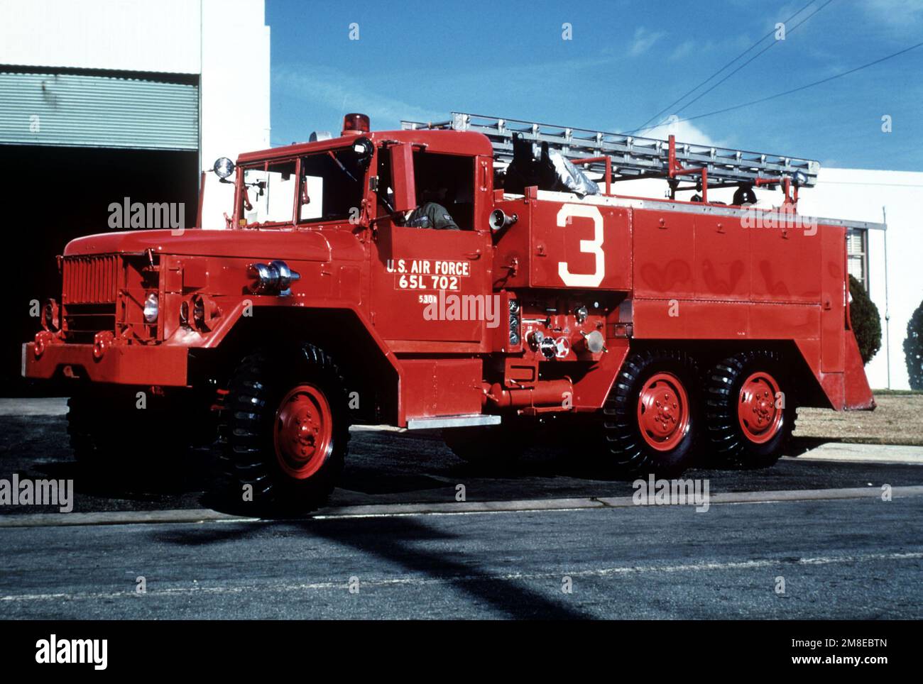 A left side view of an Air Force 530B structural pumper firefighting ...