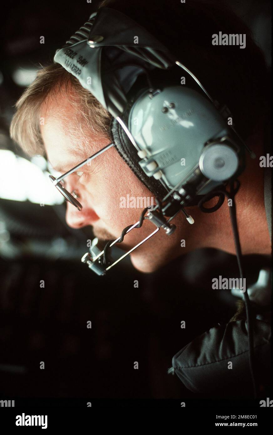 The boom operator aboard a KC-10A Extender aircraft watches the ...