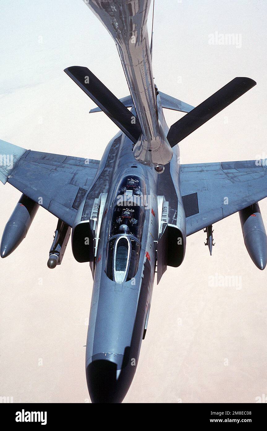 A 35th Tactical Fighter Wing F-4E Phantom II aircraft approaches the refueling boom of a KC-135 ...