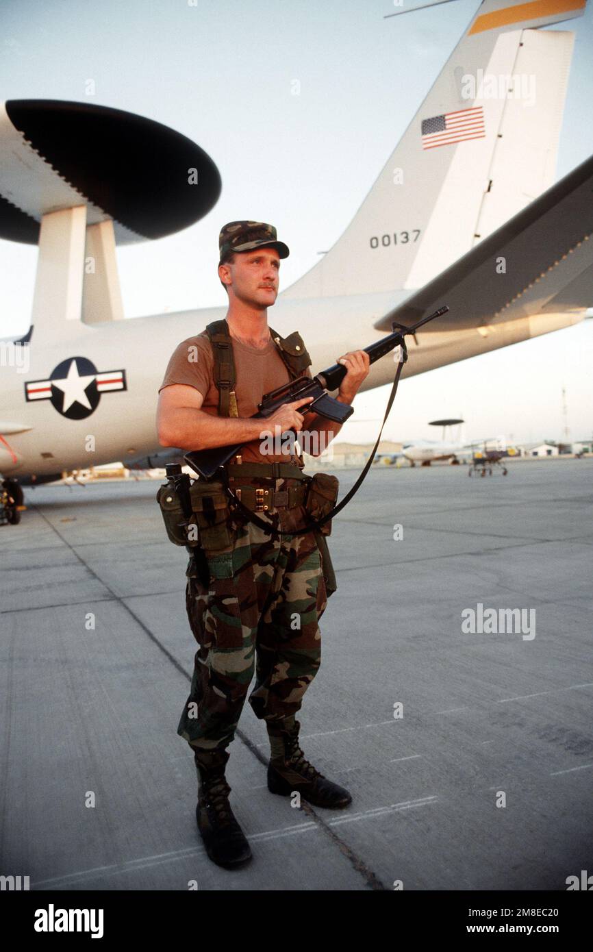 SGT. Russel C. Jones, armed with M-16 rifle, guards an E-3A Sentry ...