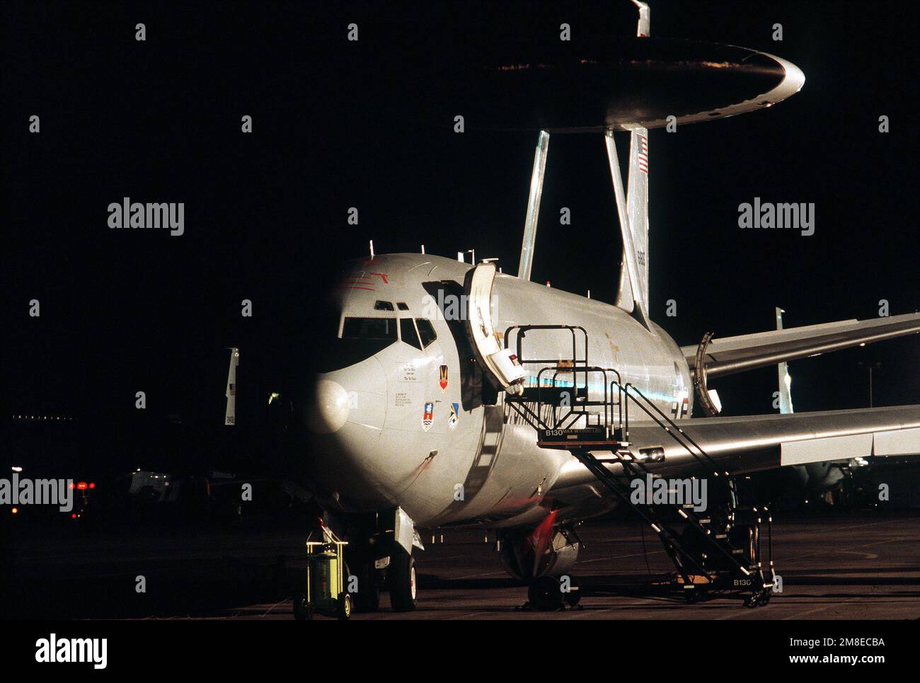 An E-3A Sentry aircraft receives maintenance between flights during ...