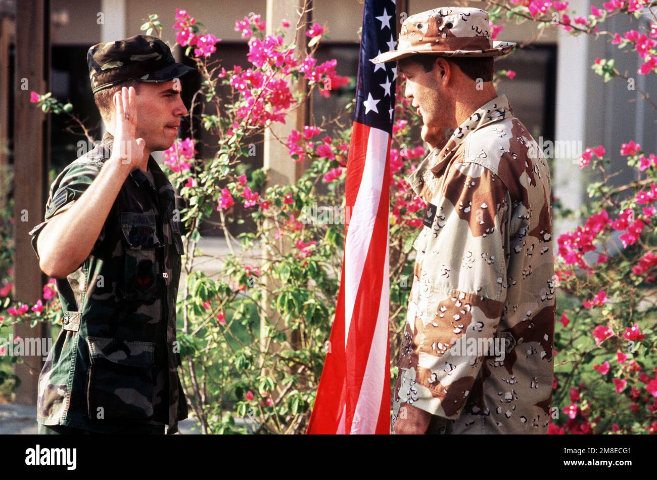 COL. Carl Loveland reenlists SGT. Todd Johnson, Headquarters Squadron ...
