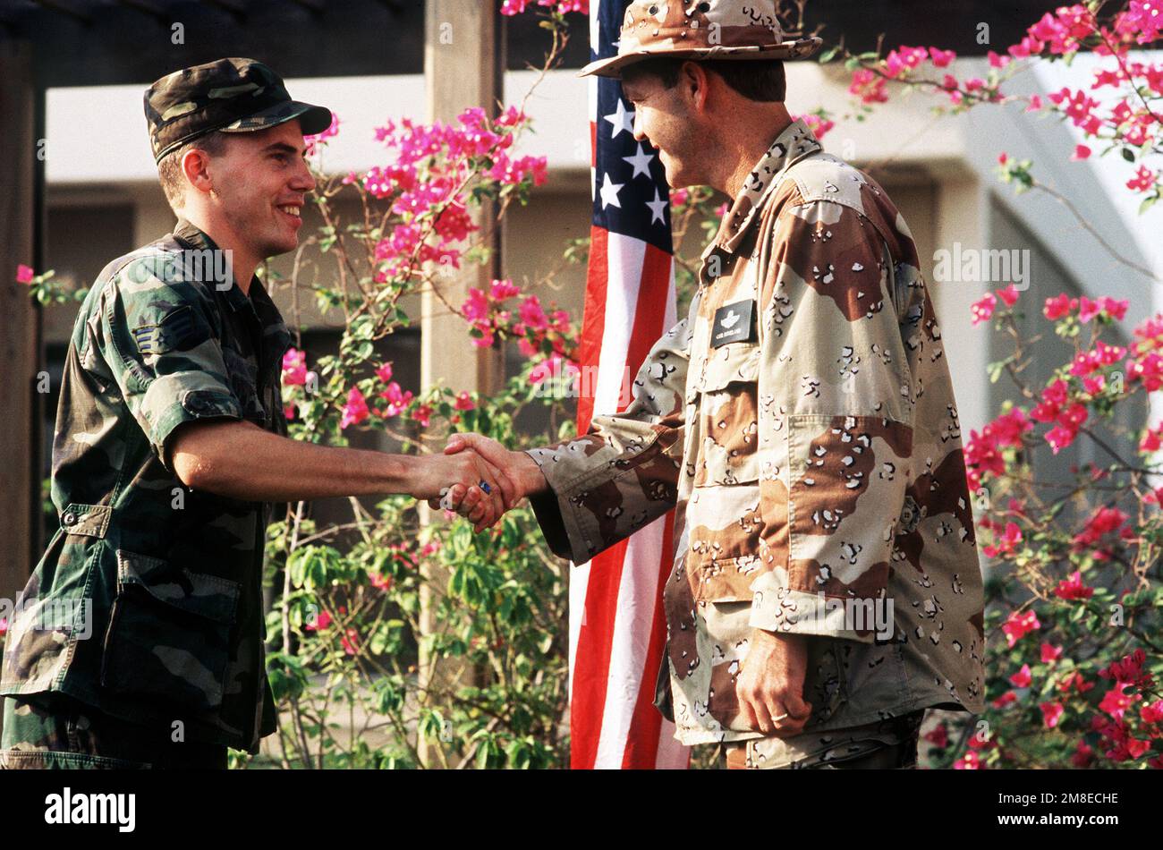 COL. Carl Loveland congratulates SGT. Todd Johnson, Headquarters ...
