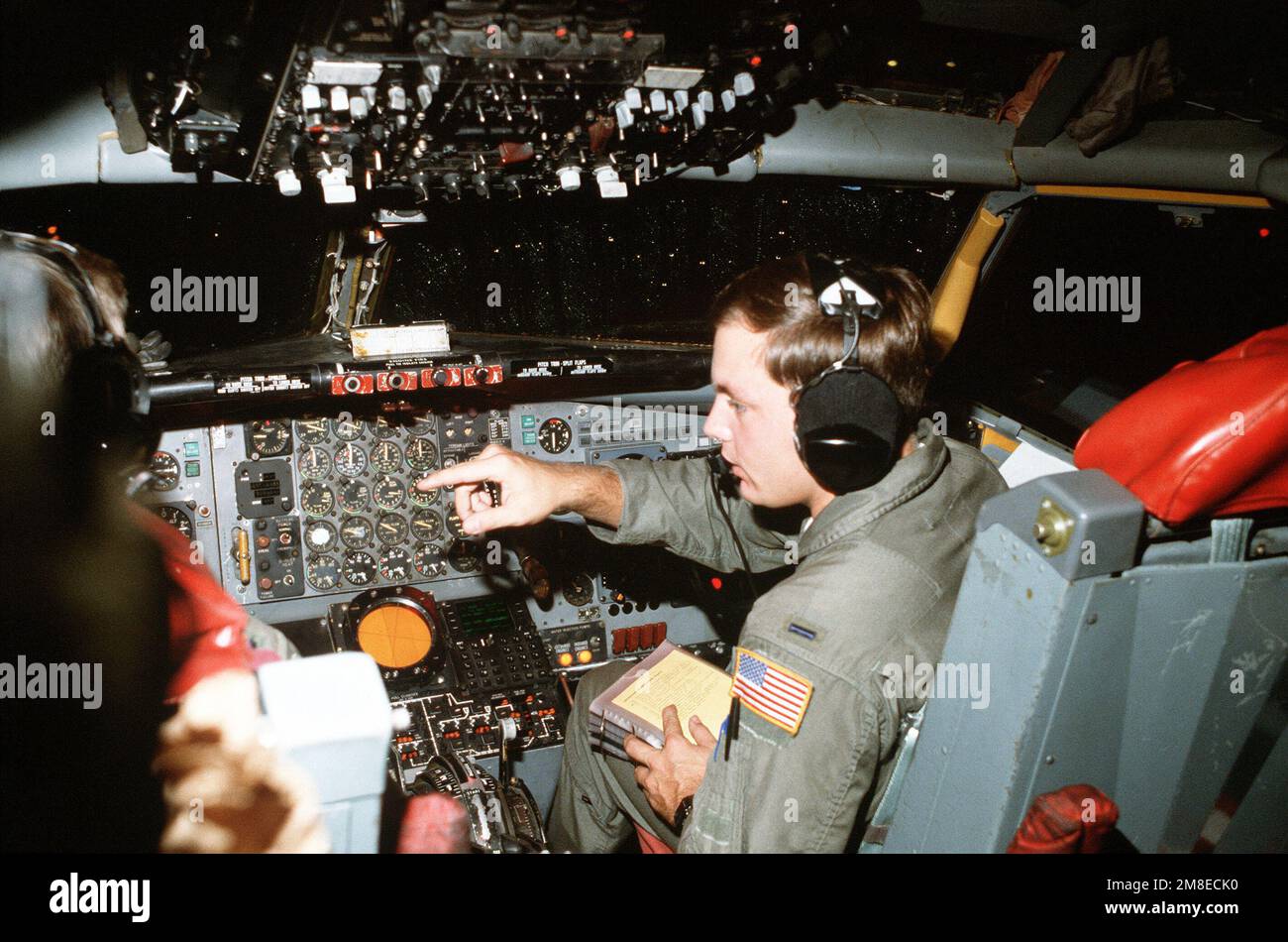 LT. Bob Dittus, the pilot of a KC-135 Stratotanker aircraft, runs ...