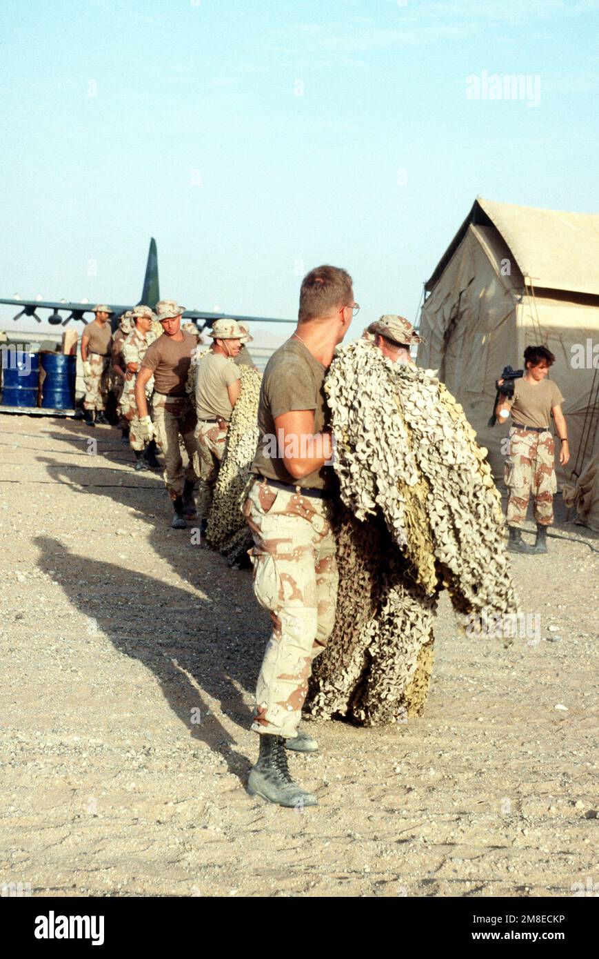 Members of the 3rd Combat Communications Group prepare to raise a large ...