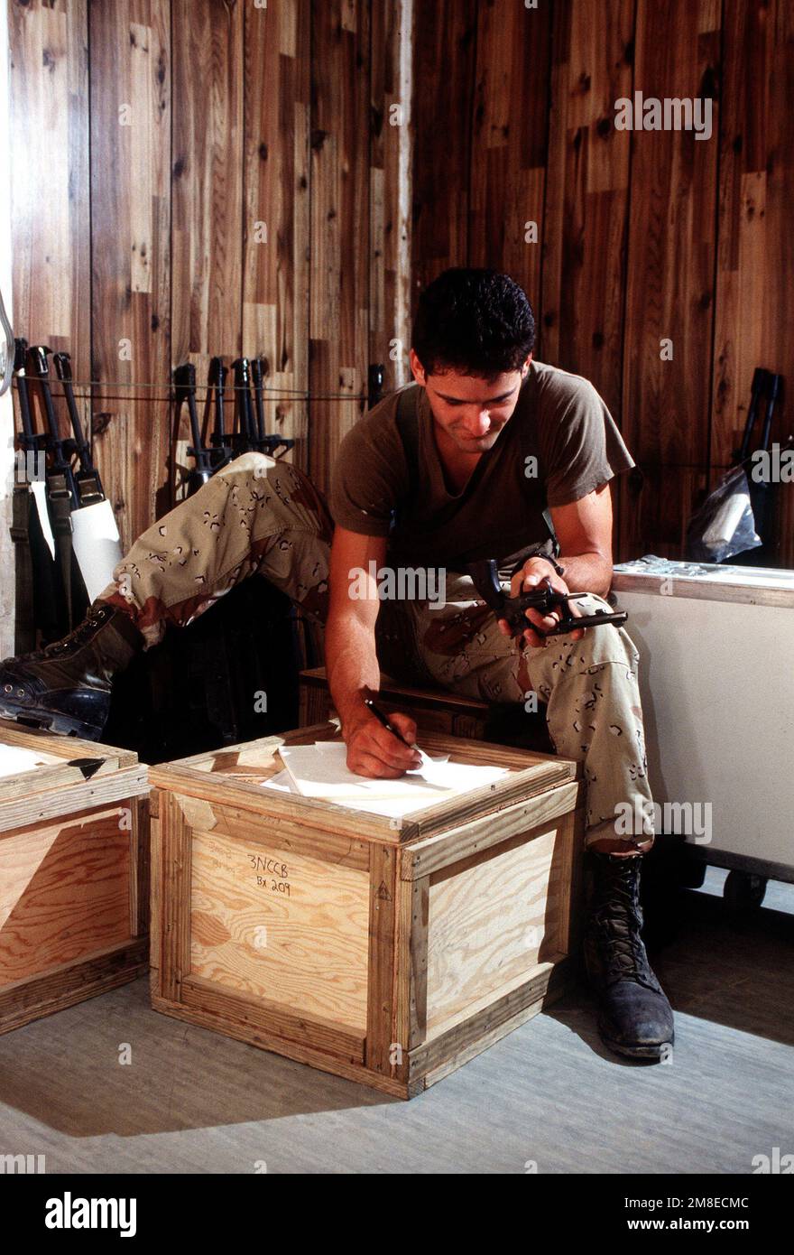 SGT. Dave Gendron records the serial number on a .38-caliber revolver ...