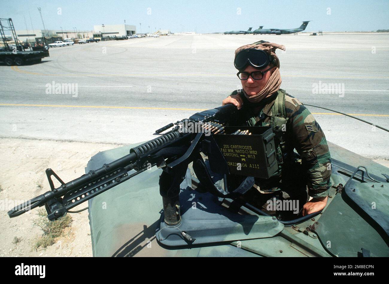 An Air Force security policeman mans an M-60 machine gun mounted on the ...