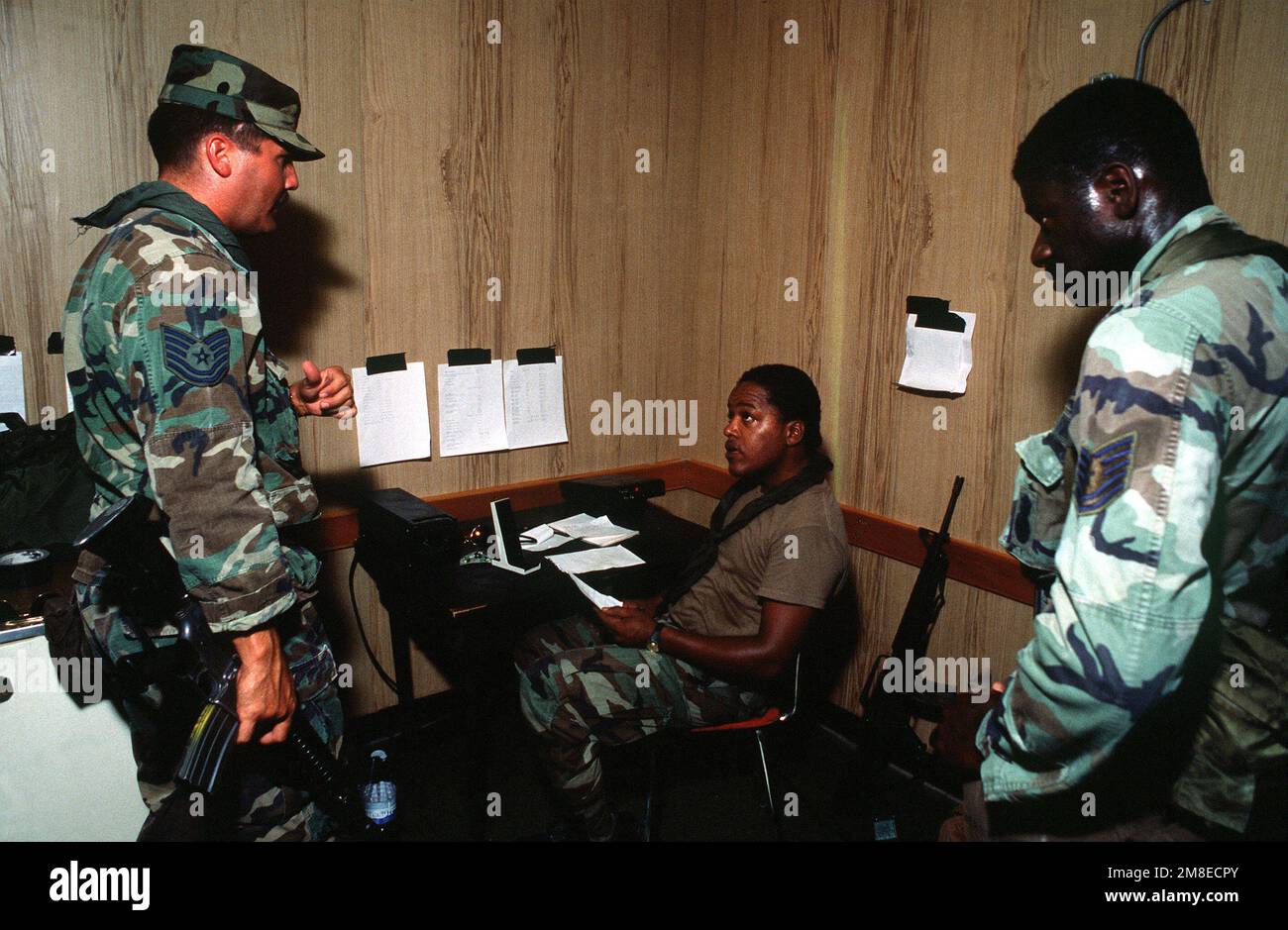 Members of an Air Force security police unit have a discussion in the ...