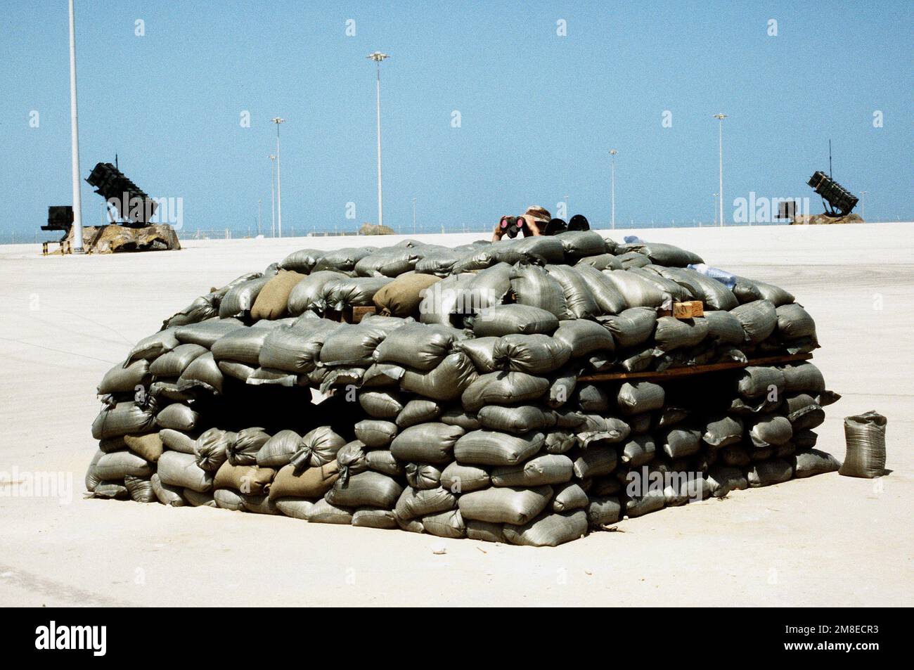 A soldier of the 7th Air Defense Artillery Brigade keeps watch from a ...