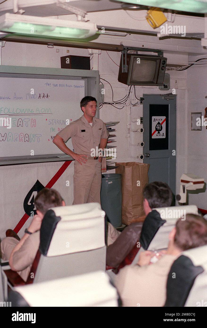 LT. Greg Stubbs of Fighter Squadron 41 (VF-41) conducts a briefing in ...