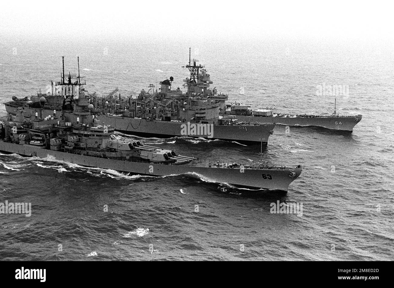 The fast combat support ship USS SACRAMENTO (AOE-1), center, conducts ...