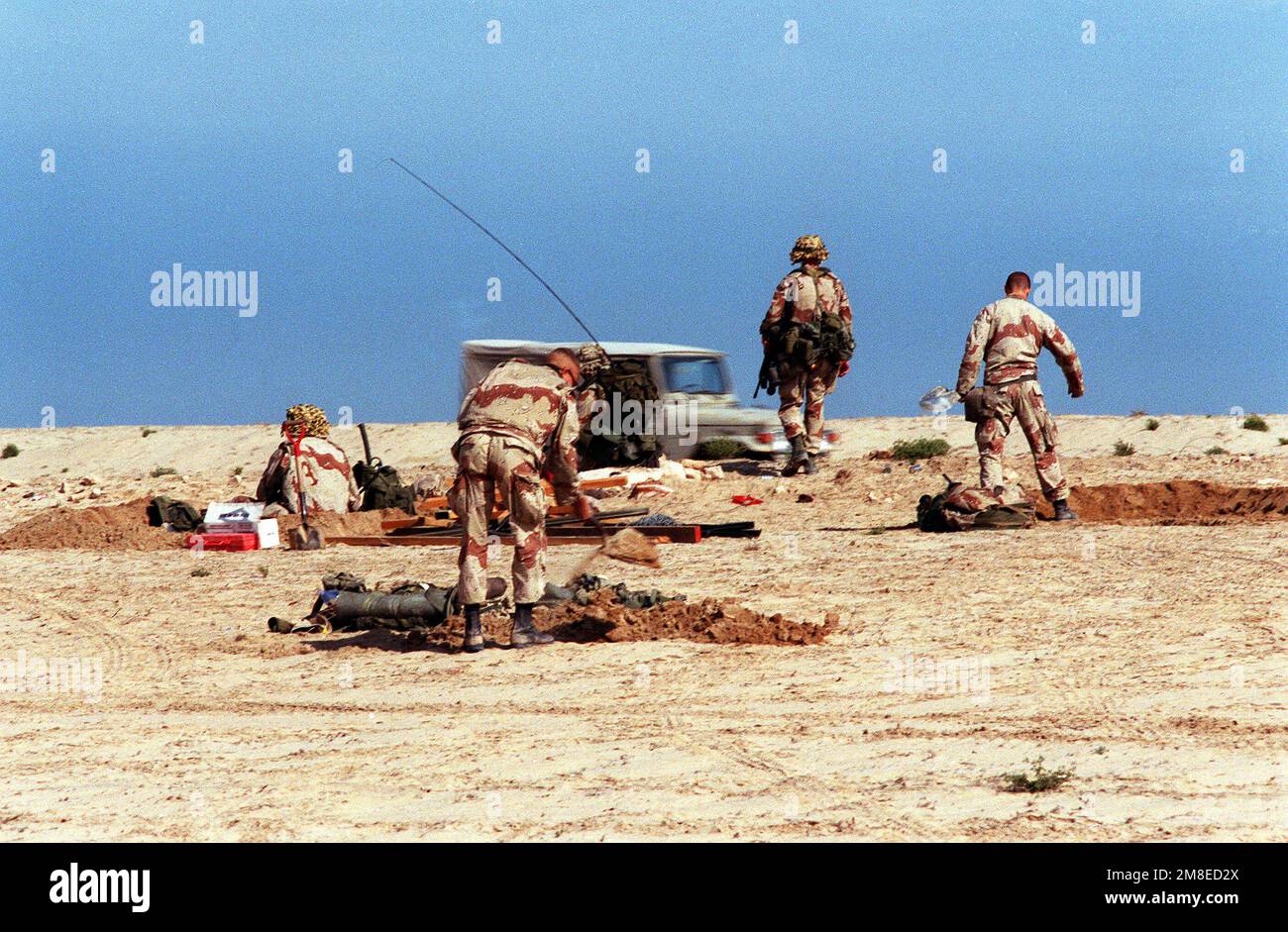 Members of the 1ST Plt., Co. K, 3rd Bn., 3rd Marine Regt., dig foxholes ...