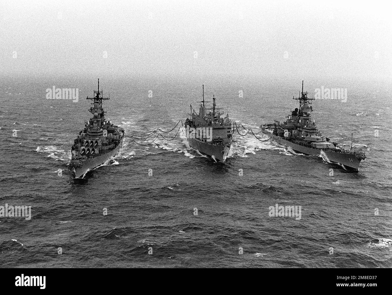 The fast combat support ship USS SACRAMENTO (AOE-1), center, conducts ...