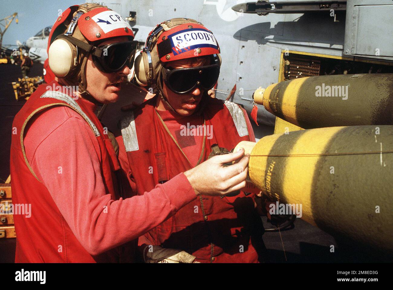 A chief petty officer from Attack Squadron 72 (VA-72) talks to an ...