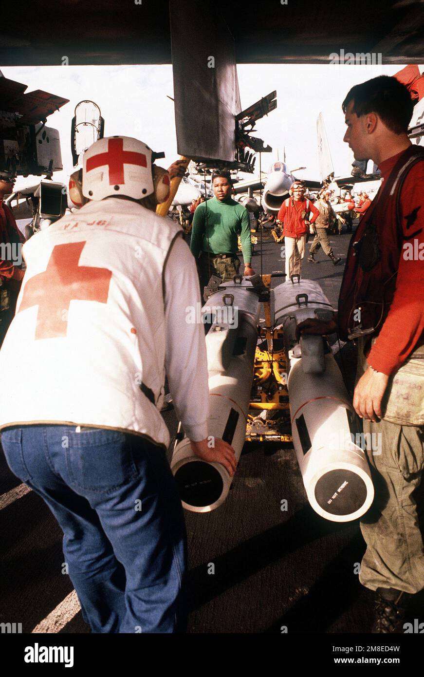 Aviation ordnancemen of Attack Squadron 46 (VA-46) load AGM-88A HARM ...