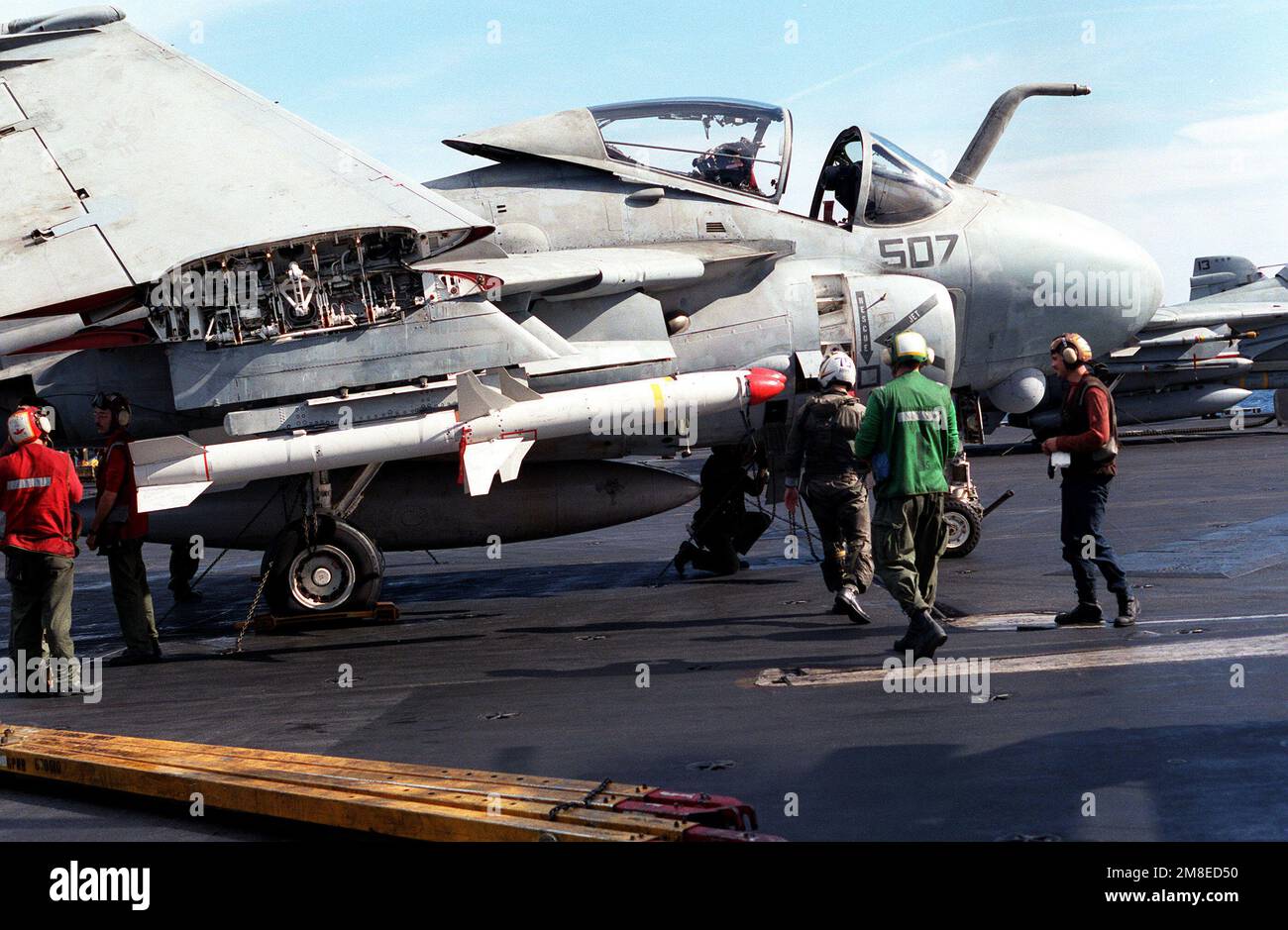 A bombardier/navigator from Attack Squadron 75 (VA-75) walks toward his ...