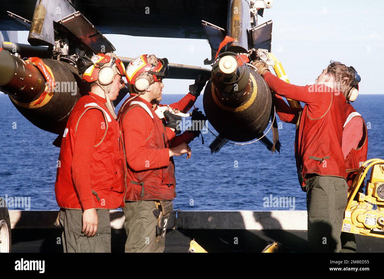 Aviation ordnanceman on the flight deck of the aircraft carrier USS ...