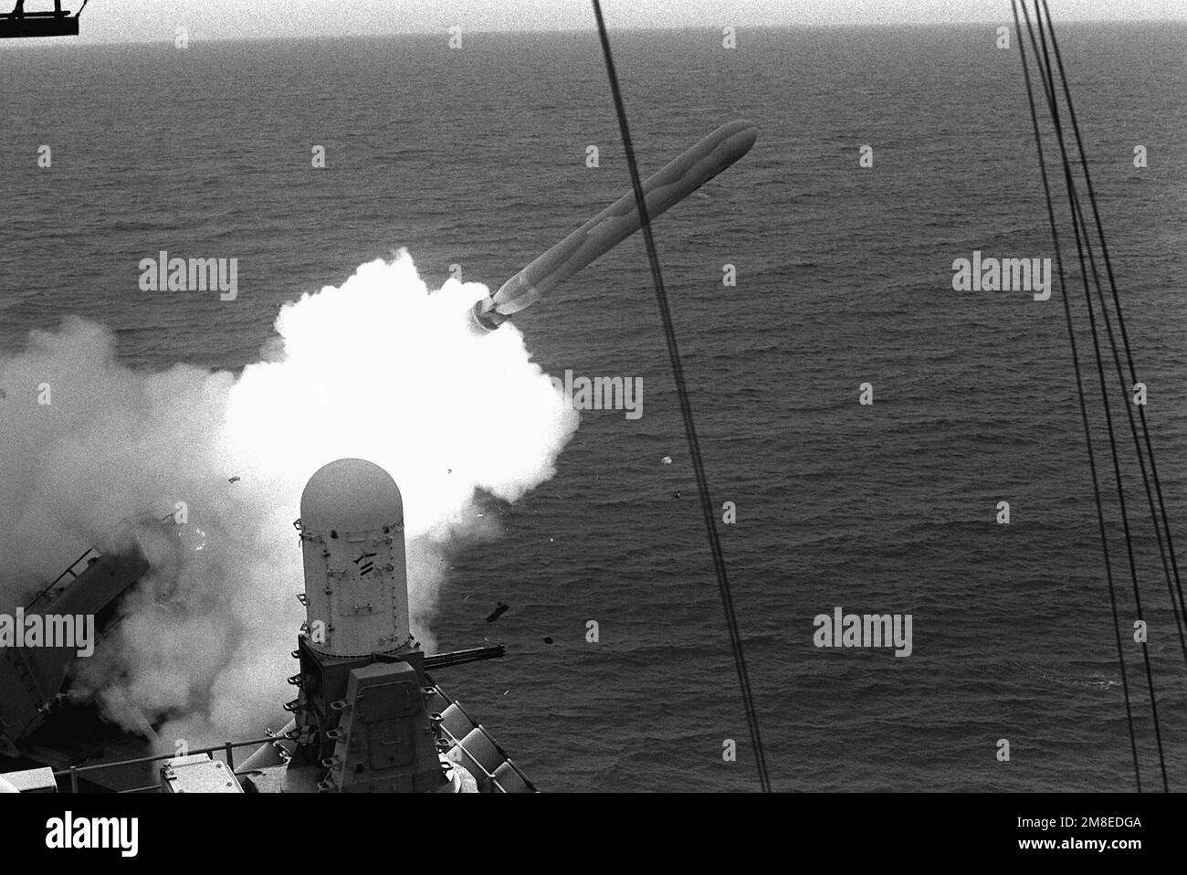 A Tomahawk BGM-109 land attack missile (TLAM) is fired from a Mark 143 ...