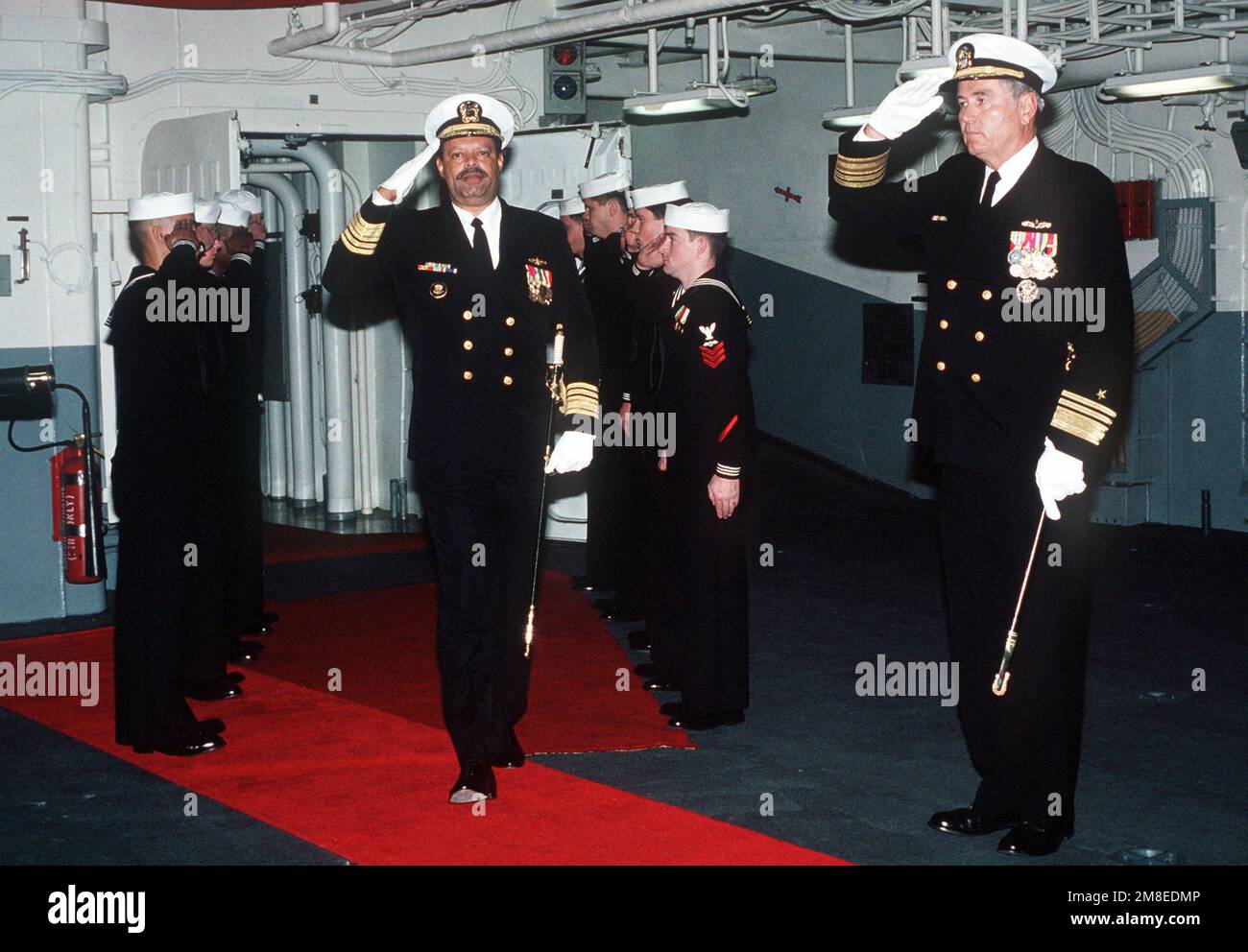 VADM Joseph S. Donnell III salutes as VADM Joseph P. Reason arrives for ...