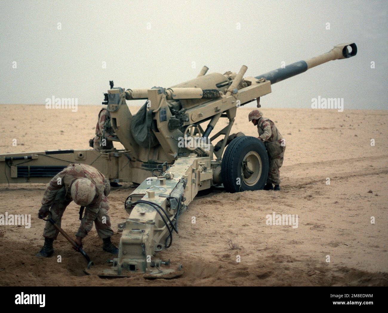 Marine artillerymen set up their M-198 155mm howitzer for a fire ...