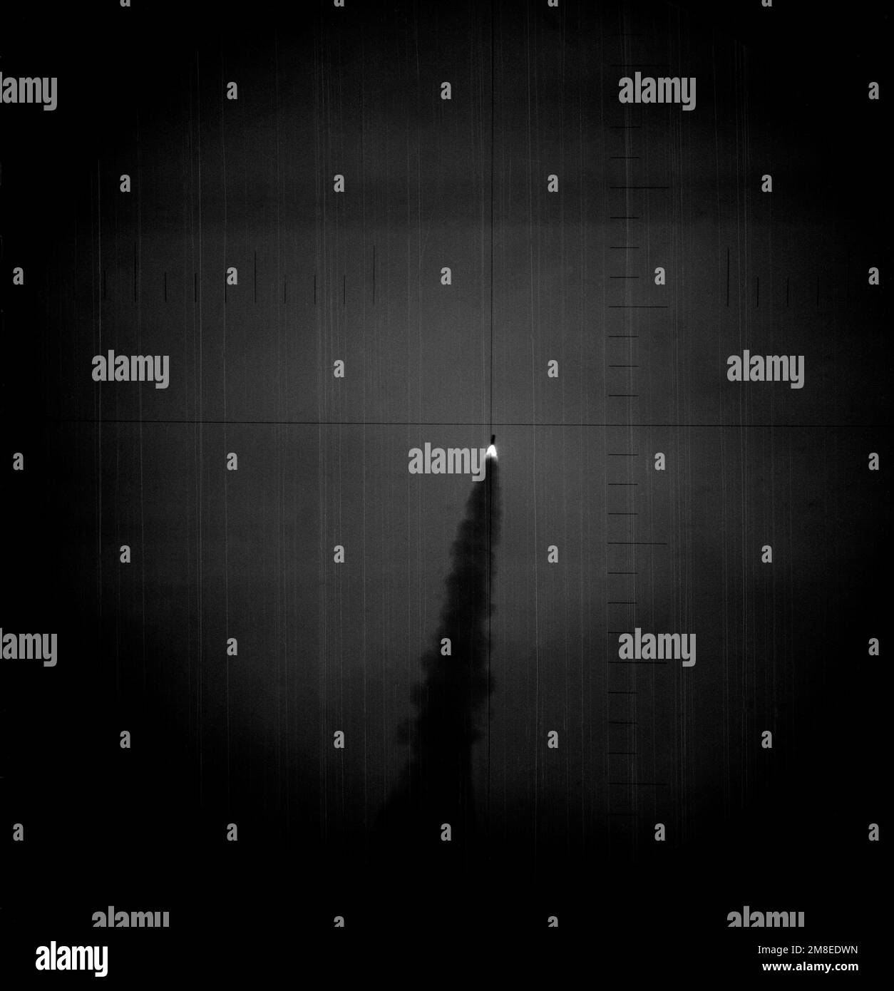 As seen through the submarine's periscope, a BGM-109 Tomahawk land ...