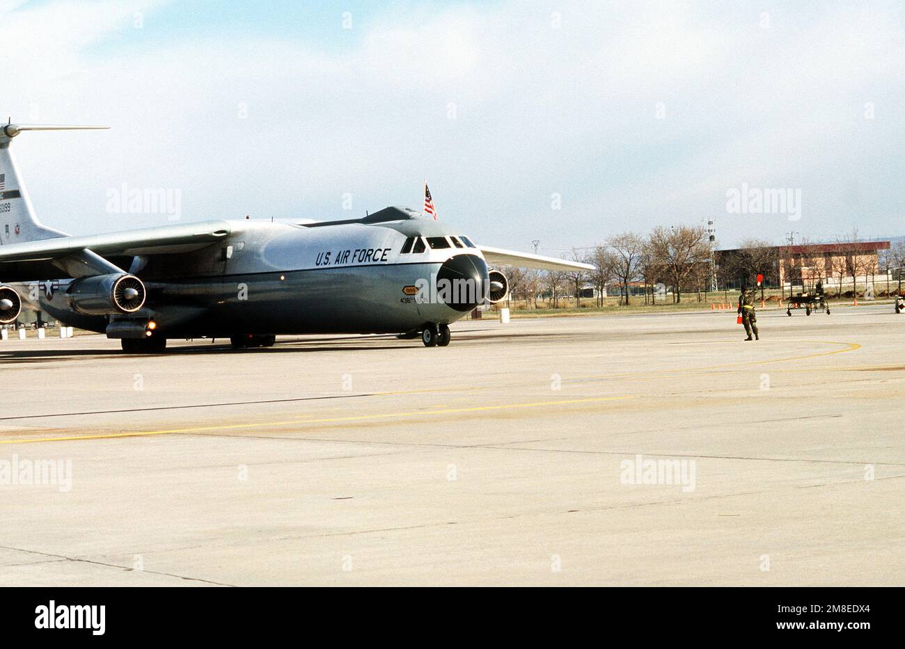 A 438th Military Air Wing C-141B Starlifter aircraft stands on the ...
