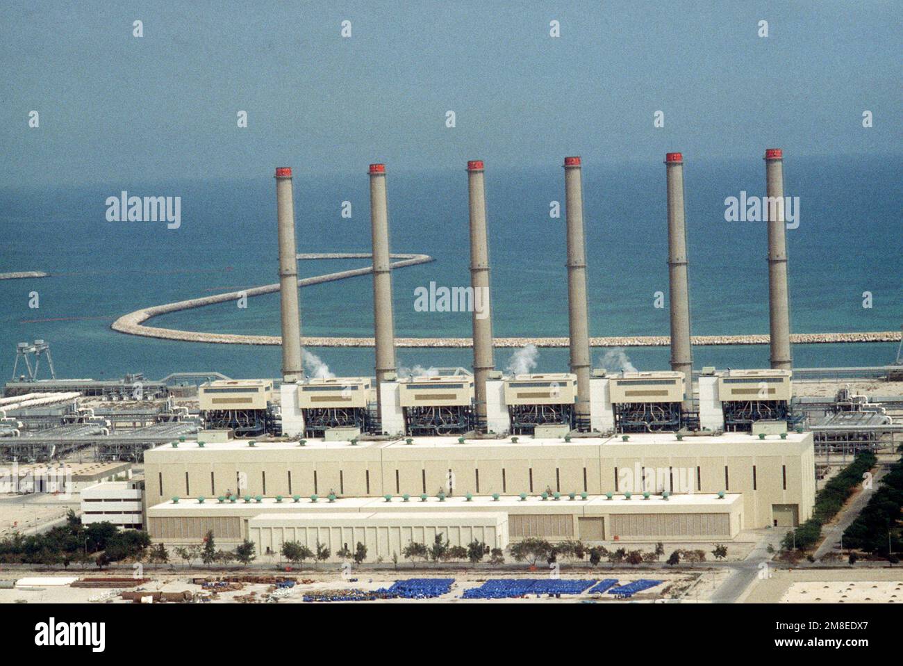 A pier and industrial plant in the Mideast. Subject Operation/Series ...