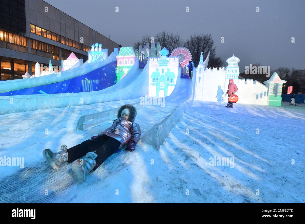 Moscow. Driving from the hill at a New Year's festival 'Ice Moscow. In ...