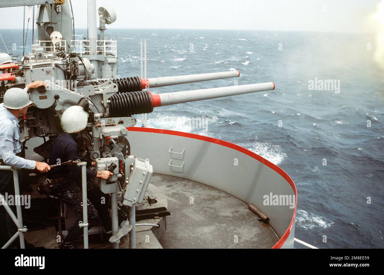 GUNNER's mates fire a Mark 33 3-inch/50-caliber gun aboard the ...