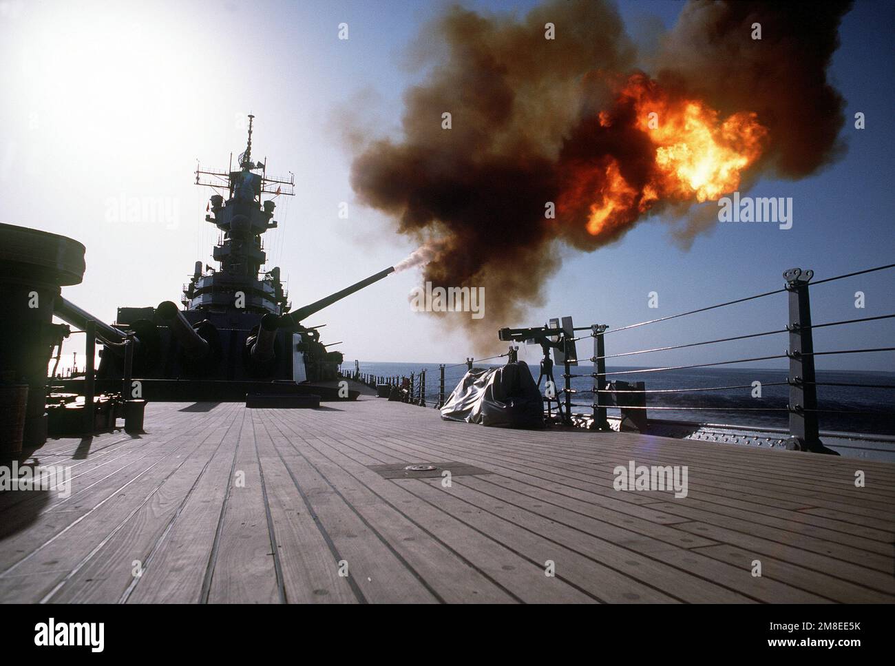 The battleship USS WISCONSIN (BB-64) fires one of its Mark 7 16-inch/50 ...