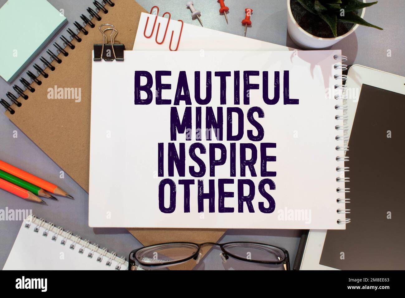 Hand with marker writing the word Beautiful Minds Inspire Others Stock ...