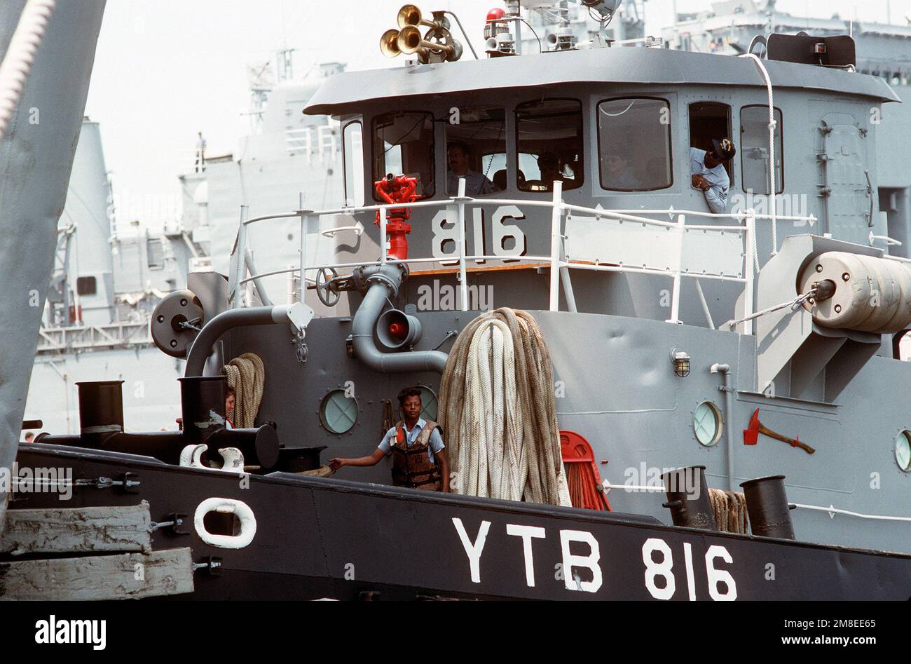 The large harbor tug CAMPTI (YTB-816) pulls into port. The vessel is ...