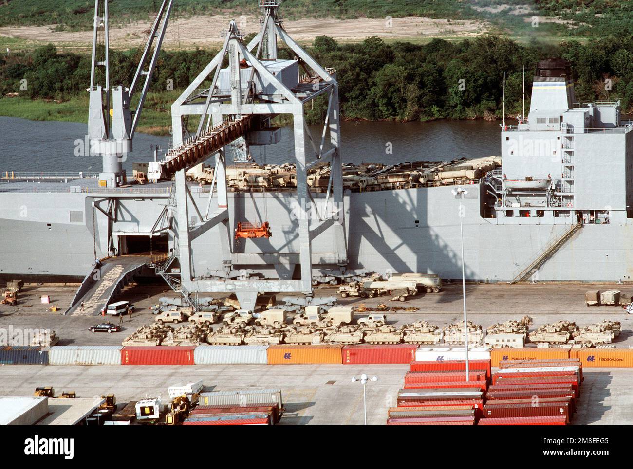 Equipment of the 24th Infantry Division is loaded aboard a rapid ...